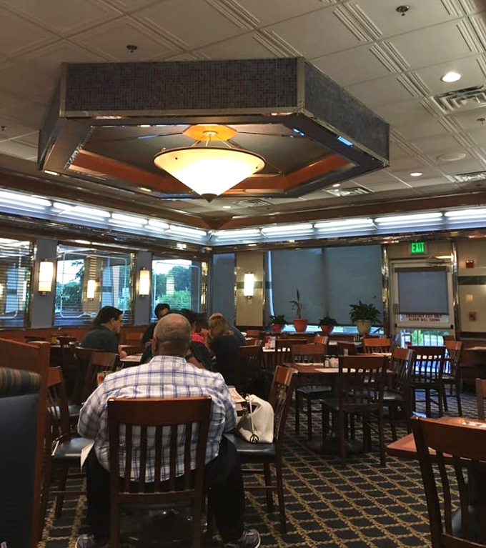 The dining room hums with the quiet energy of a community gathering place where everyone's story intersects over plates of comfort food.