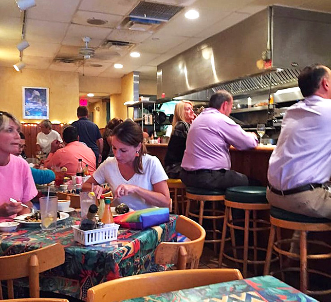 The bustling dining room hums with the satisfied murmurs of patrons who've discovered Florida's best-kept seafood secret.