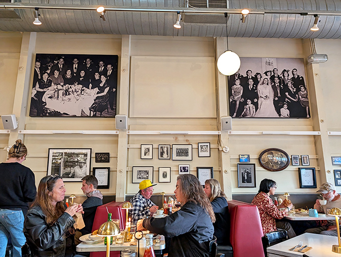 Historic photos watch over diners engaged in that timeless ritual: solving the world's problems over excellent food.