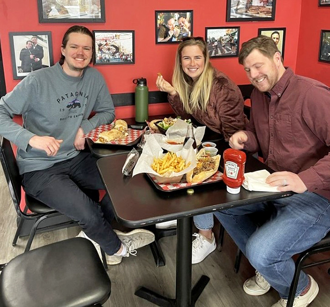 Happy diners experiencing the universal language of good food &ndash; that moment when conversation stops and appreciative nodding begins.