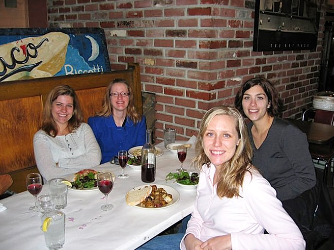 Happy diners sharing wine, conversation, and the kind of meal that makes memories&mdash;the true Italian dining experience.