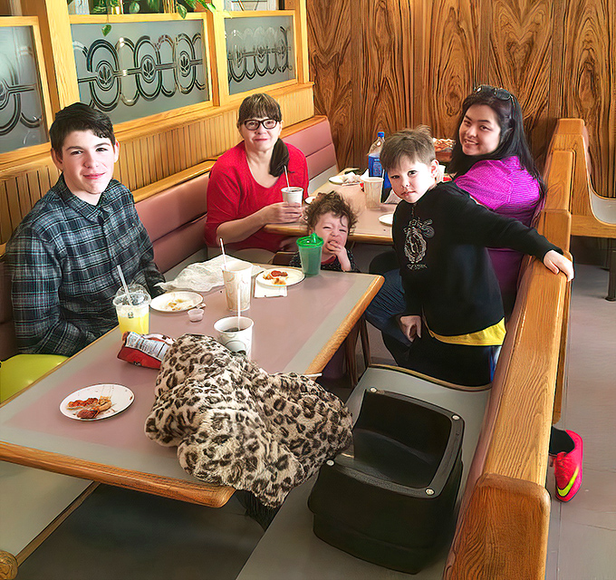 The family booth at Joe's&mdash;where memories are made between bites and napkin usage reaches Olympic levels.