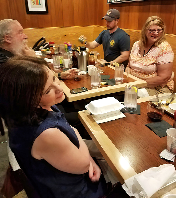 The dining room where strangers become friends, united by the universal language of "mmm" and "pass the napkins, please."