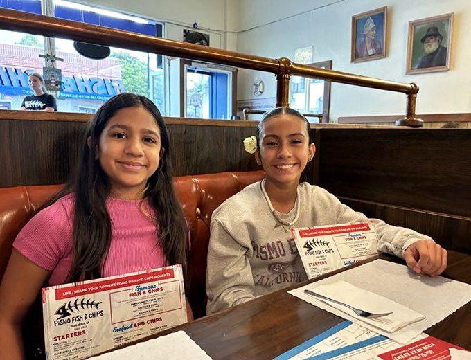 Happy diners discovering that sometimes the best meals come from the most unassuming neighborhood spots.