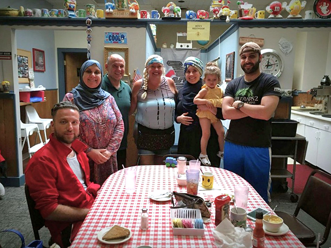 Happy diners gathered around the checkered tablecloth&mdash;the universal sign that good food and better conversation are happening simultaneously.