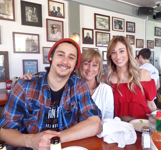 The wall of memories watches over happy diners. At Brophy Bros., every meal comes with a side of California conviviality and genuine smiles.