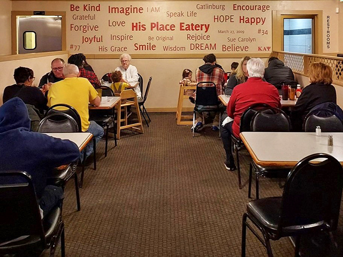 The wall of inspirational words matches the mood of diners enjoying food that makes conversation pause mid-bite.