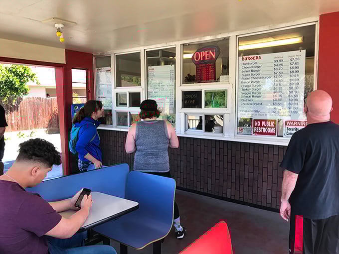The lunch rush at Snowhite isn't just about eating&mdash;it's a community ritual where all social barriers dissolve in pursuit of burger bliss.