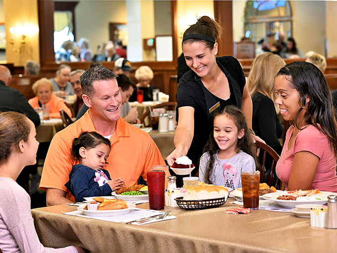A server delivers dessert to a delighted family&mdash;creating the kind of memory that will have them saying "remember that pie?" for decades.