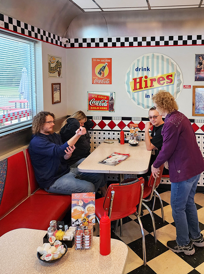 Where strangers become friends over coffee and conversation. The vintage Coca-Cola signs watching over decades of shared meals and memories.
