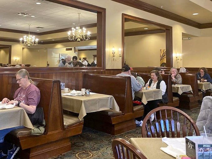 Wooden booths cradle conversations between friends and family while mirrors reflect decades of "remember when" moments shared over pie.