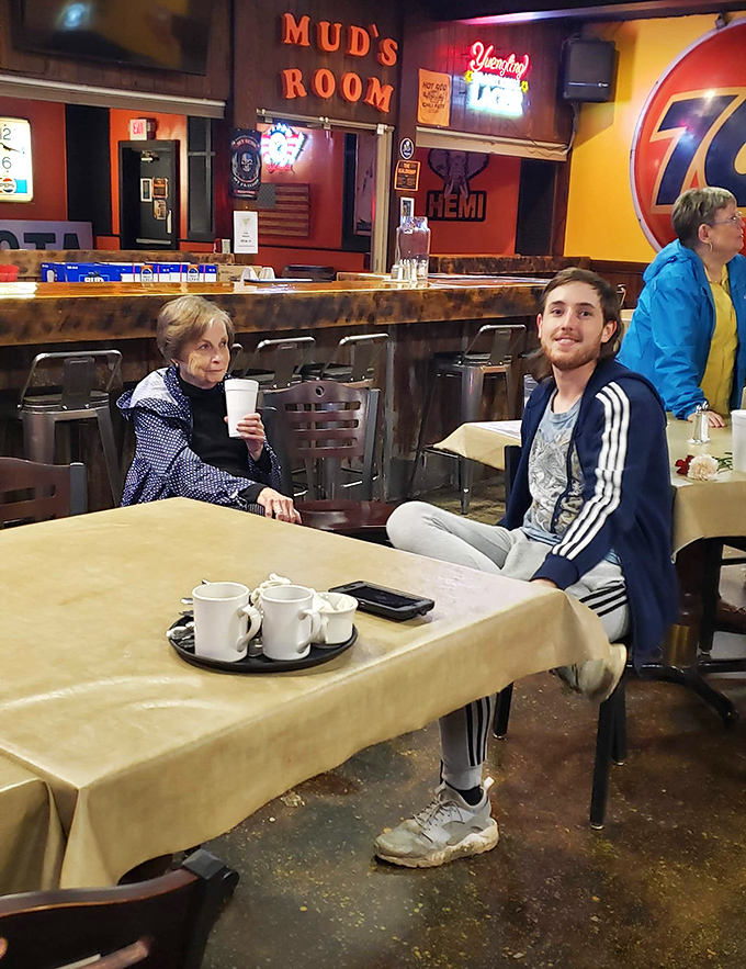 The dining area where strangers become neighbors and neighbors become family. Every table holds stories seasoned with laughter and good food.