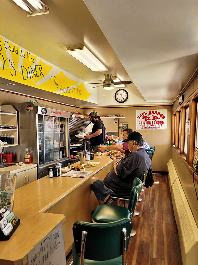 The counter seating offers front-row tickets to the breakfast show, where coffee flows freely and conversation never runs dry.