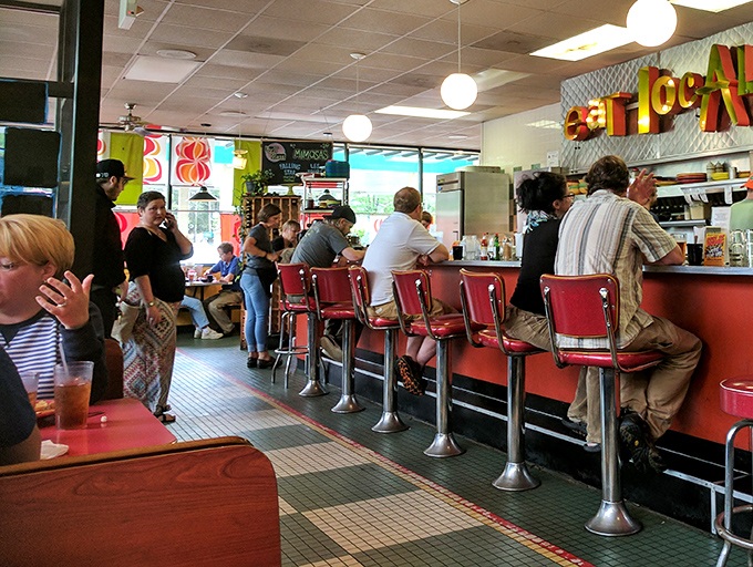 The counter buzzes with locals and travelers sharing the universal language of "mmm" and "you've gotta try this."