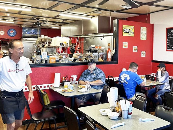 The dining room hums with the comfortable rhythm of regulars and newcomers alike, all united by the universal language of good food.