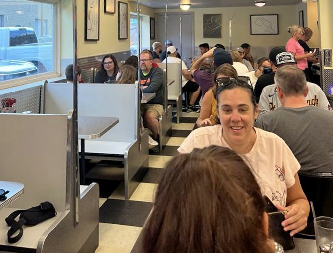 The packed dining room tells you everything—these booths hold more breakfast stories than a morning talk show.