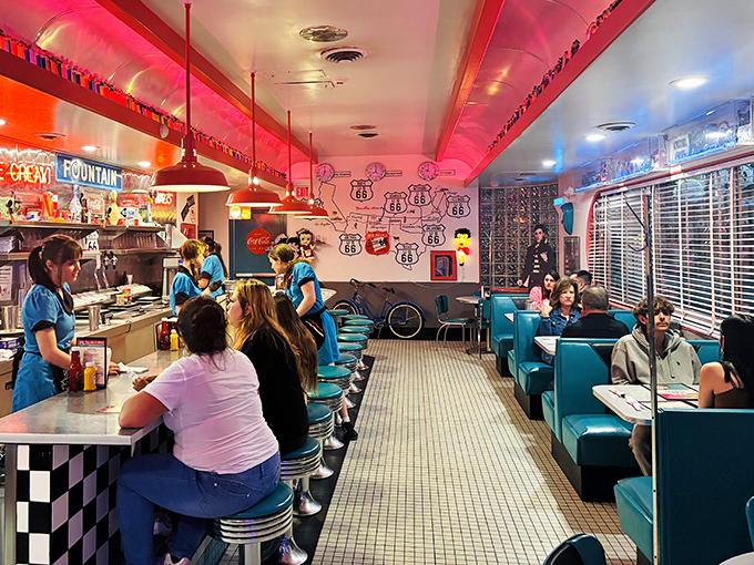 The counter experience—where strangers become friends over coffee refills and the shared religion of comfort food.