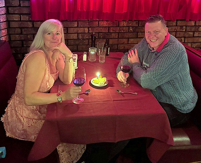 The dining room hums with the universal language of "mmm" as couples celebrate occasions that will be remembered long after the last bite.