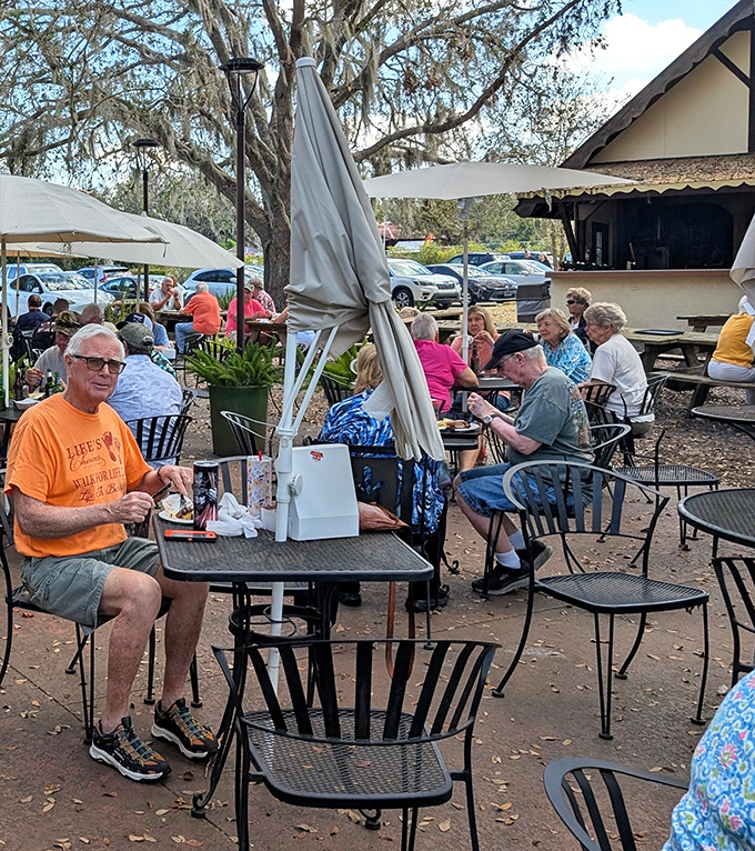 Happy diners experiencing that magical moment when conversation stops because the food demands complete attention.