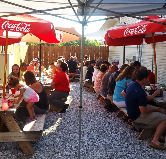 The outdoor dining area transforms strangers into neighbors, united by the universal language of "mmm" and "pass the napkins, please."