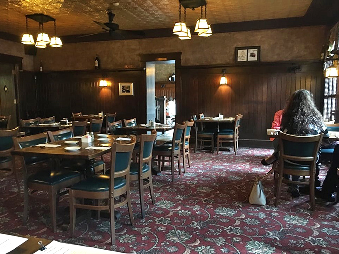 The dining room's pattern-rich carpet and wood-paneled walls create the perfect backdrop for lingering conversations and "just one more bite" moments.