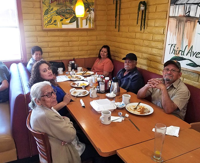 Where breakfast becomes community. Multi-generational families gathering around tables laden with morning favorites&mdash;the true magic of a neighborhood institution.
