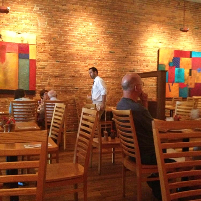 The dining room hums with the satisfied murmurs of people having religious experiences with pasta. Those colorful paintings aren't just decoration&mdash;they're conversation starters.