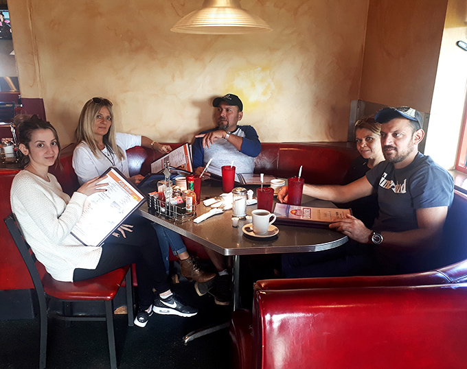 Multi-generational breakfast gatherings happen naturally when the food brings families together like this.