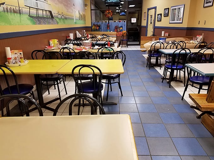 The dining room might not win design awards, but that mural of the Chesapeake and those blue chairs tell you you're in seafood country.