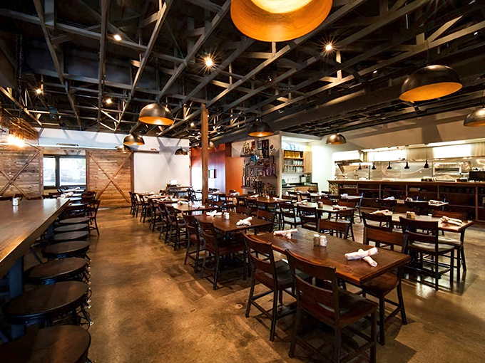 The dining room balances rustic and refined&mdash;like if a barn went to design school and came back with sophisticated ideas.