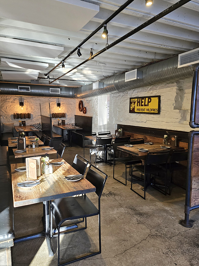 The dining room feels like it was designed by someone who actually eats in restaurants. Exposed brick, warm lighting, and tables positioned for conversation.