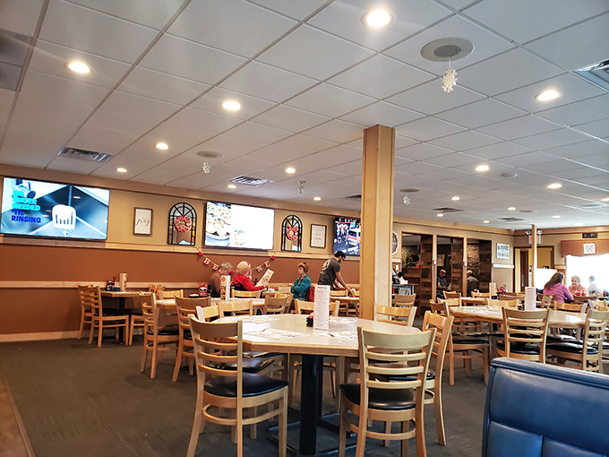 Tables filled with the universal language of satisfied diners &ndash; the quiet concentration of people eating well.