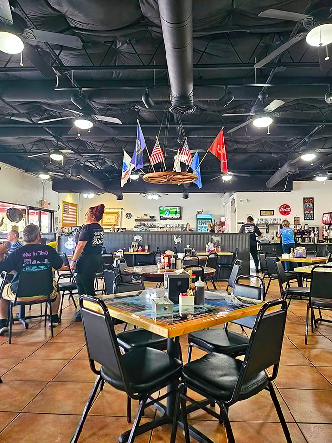Military flags hang proudly from the ceiling in a dining room where conversations flow as freely as the coffee refills.