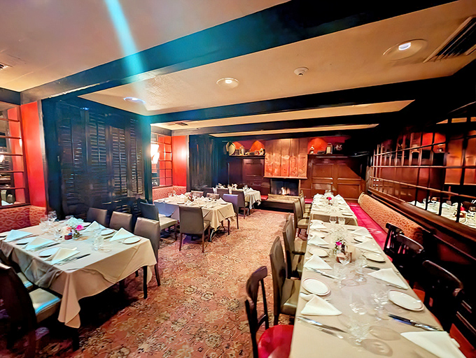 One dining room reveals the restaurant's clubby charm with wood-paneled walls and crisp white tablecloths – like stepping into a delicious time machine.