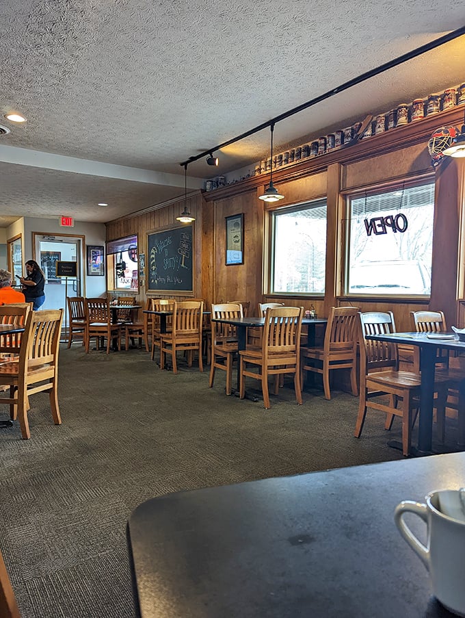 Wooden chairs, warm lighting, and windows that let in natural light create the perfect backdrop for memorable meals with friends.