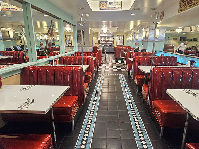 Red vinyl booths and checkerboard floors create the classic American diner experience. Just sitting here makes you feel like you're in a Norman Rockwell painting.