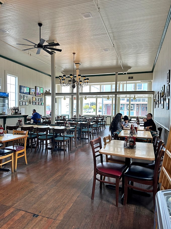 High ceilings, wooden tables, and natural light create a dining room that feels both spacious and intimate. Like eating in the galley of a particularly welcoming ship.
