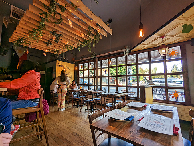 Twinkling lights and trailing plants transform this dining room into an urban jungle of delicious possibilities.