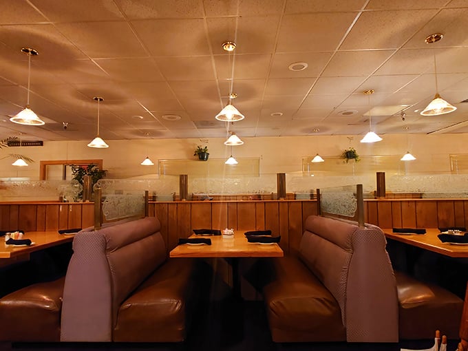 Cozy booths designed for serious eating, not selfie-taking. The kind of seating that invites you to settle in and forget about your diet.