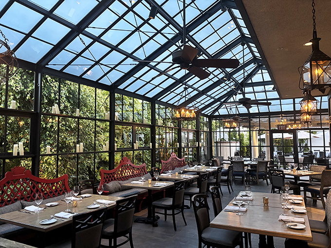 The greenhouse dining area brings the outside in, offering sunshine by day and starlight by night without sacrificing climate control.