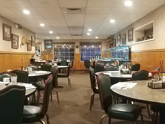 The dining area after hours&mdash;tables waiting for tomorrow's breakfast rush like an empty stage before the performance begins.