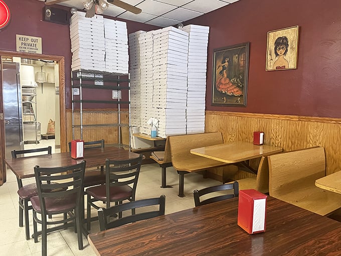 Stacks of pizza boxes stand sentinel in the dining area, a cardboard tower of pending happiness for hungry Pittsburghers.