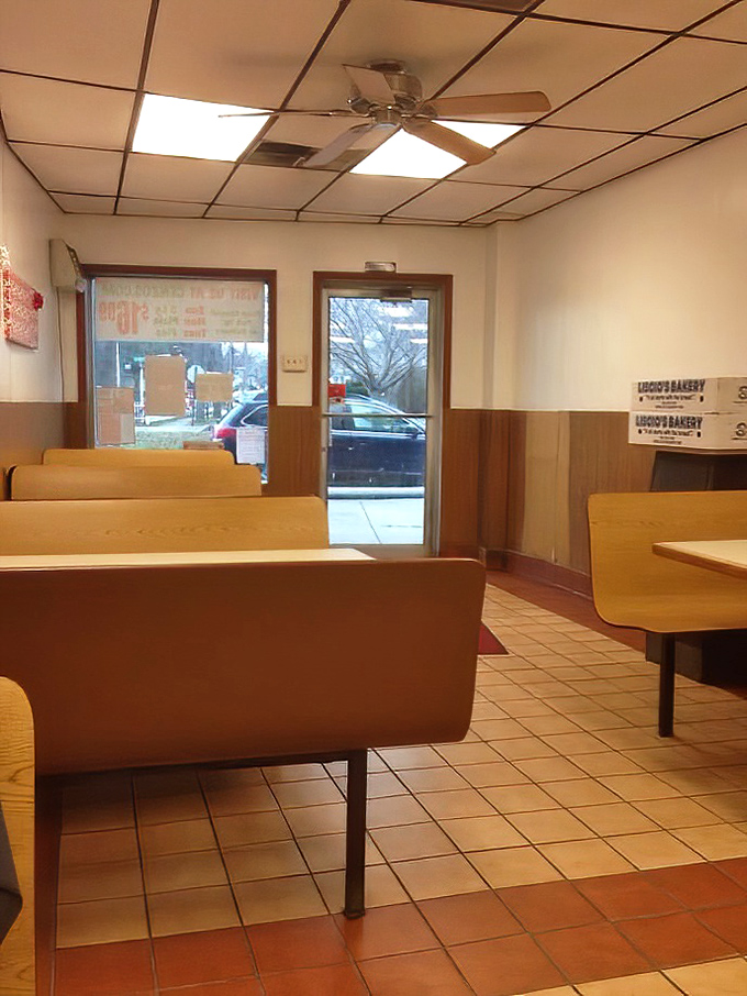 The dining area at Cenzo's keeps it simple with wooden booths and tile floors. No distractions from the main event: the food.