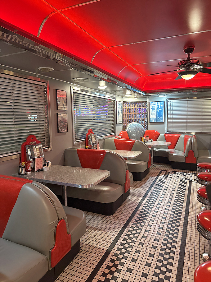 The dining area's red ceiling glows like a neon welcome sign, while booths offer the perfect balance of privacy and people-watching opportunities.