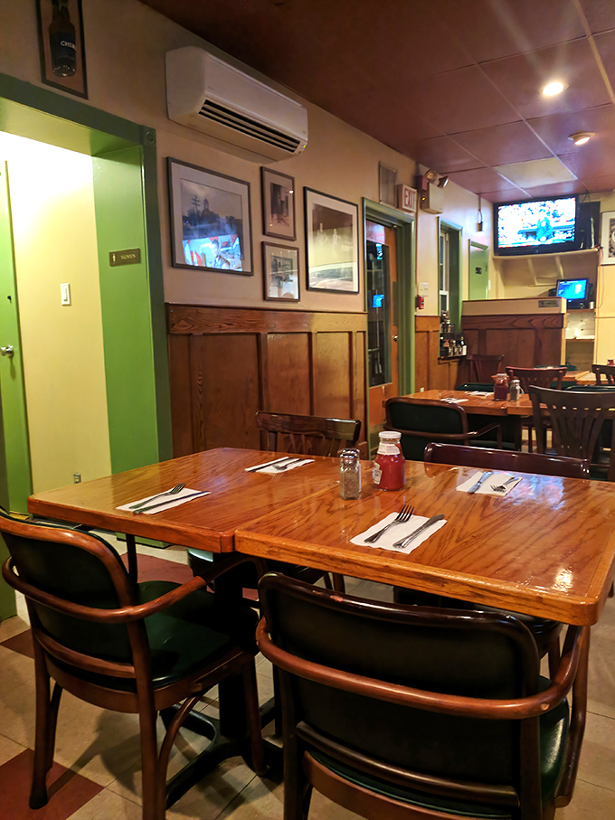 The dining area tells stories through its walls of memorabilia, while tables stand ready for the next chapter of breakfast memories.