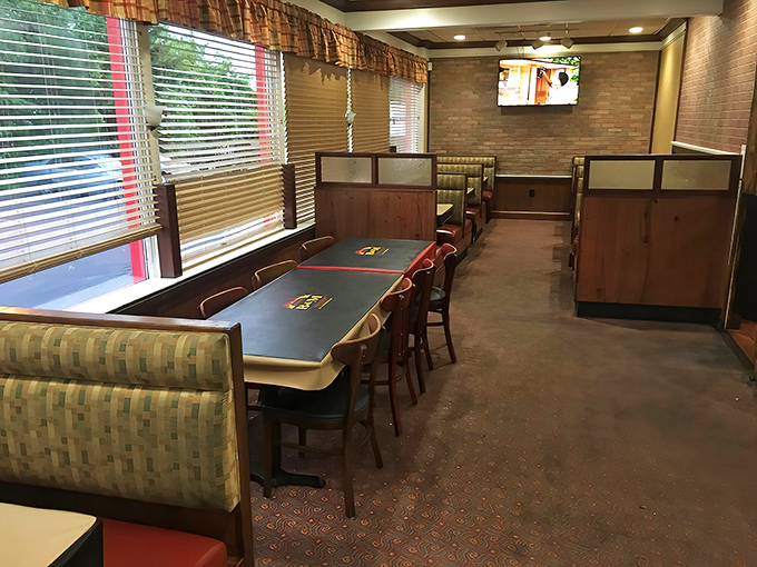 The dining area offers that perfect blend of privacy and community, where strangers become friends over shared appreciation of smoke rings.