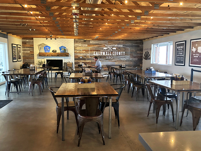 Rustic wood, metal chairs, and that Caldwell County sign&mdash;a temple of Texas-style BBQ worship in the Arizona desert.