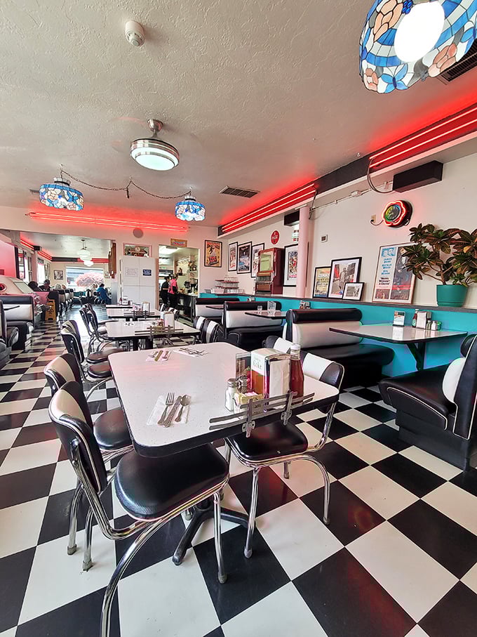 The dining area feels like it was preserved in amber from 1955, when conversations happened face-to-face and booths were vinyl thrones.