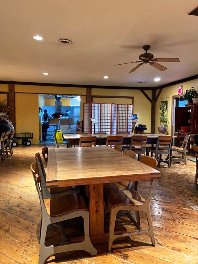 Wooden tables that could tell stories, chairs that invite lingering, and a dining room that feels like the farmhouse you wish you'd grown up in.