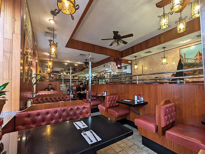 Red booths and warm lighting create the kind of cozy dining experience movies celebrate.